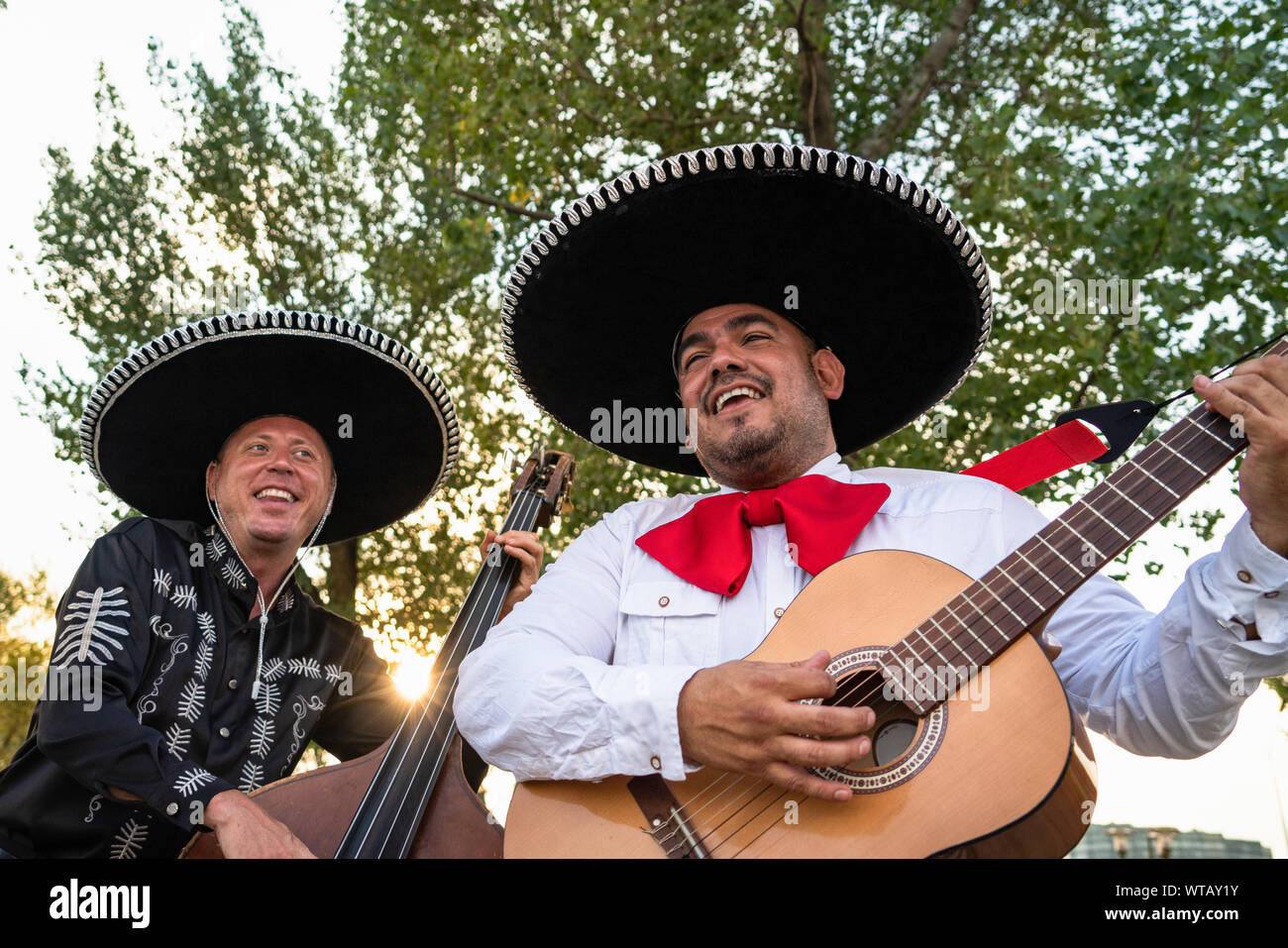 Mexican musicians mariachi band give street concert Stock Photo - Alamy
