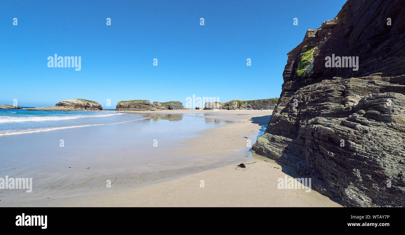 Landscape of a beach with rocky cliffs in Galicia Stock Photo - Alamy