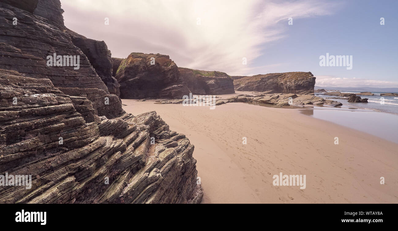 Landscape of a beach with rocky cliffs in Galicia Stock Photo - Alamy