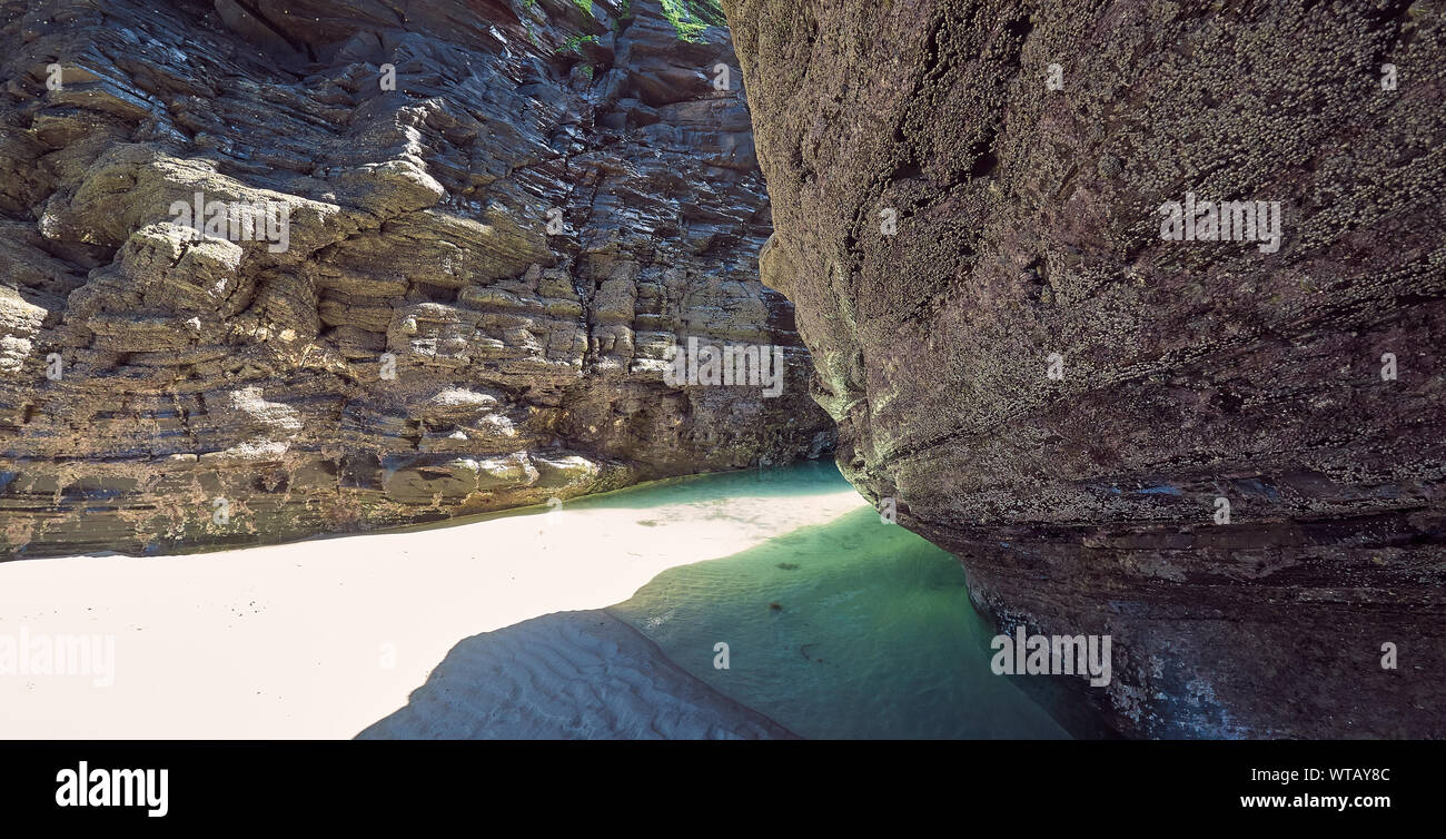 Landscape of a beach with rocky cliffs in Galicia Stock Photo - Alamy