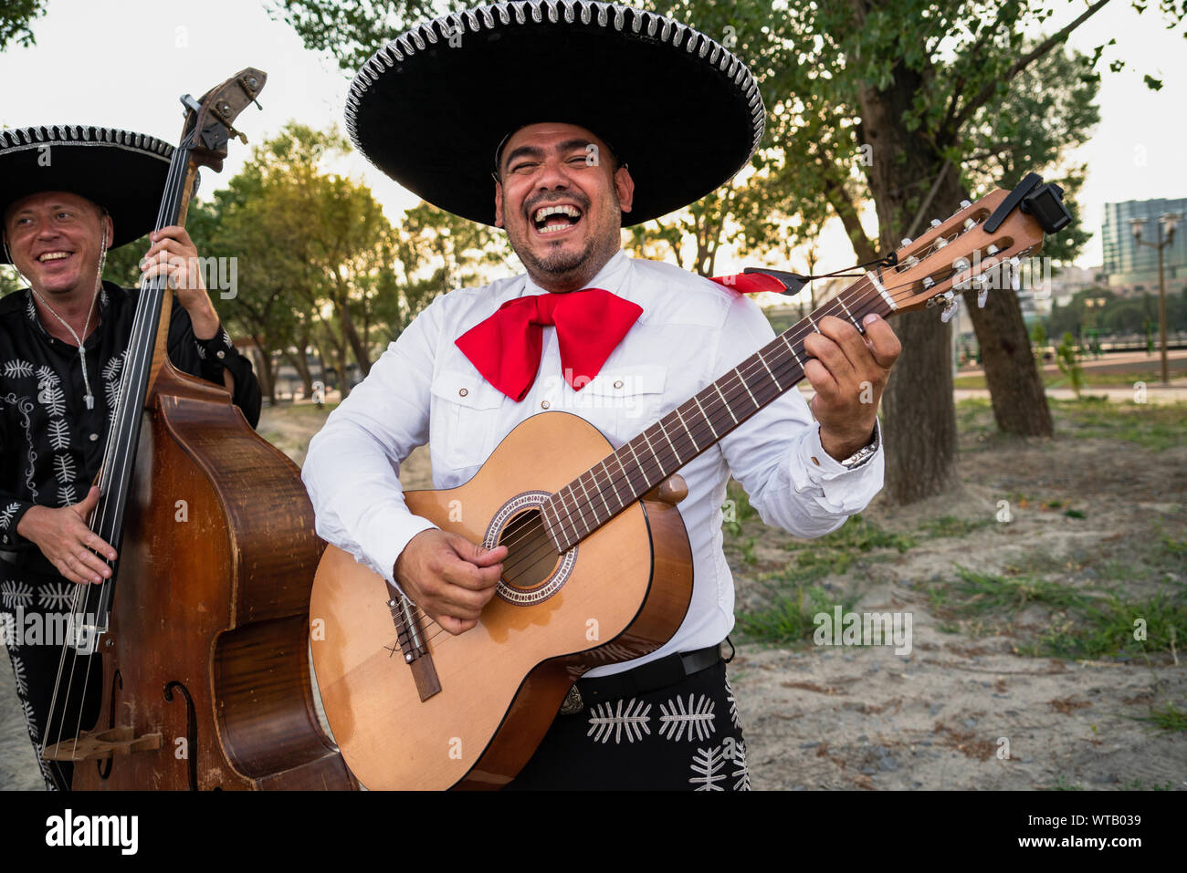 Mexican musicians mariachi playing the guitar Stock Photo - Alamy