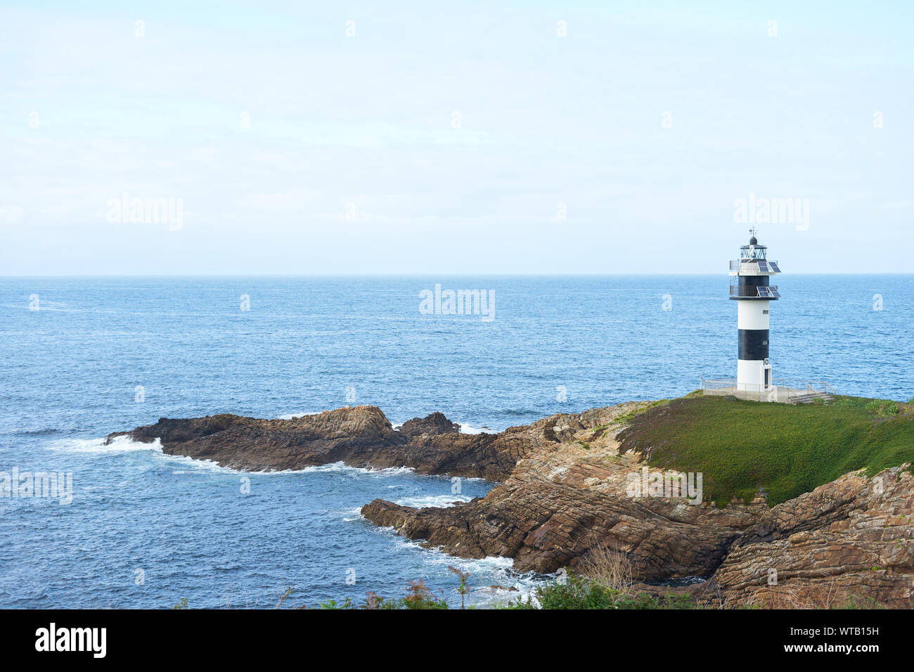 Illa Pancha lighthouse in Ribadeo, Galicia, Spain Stock Photo - Alamy