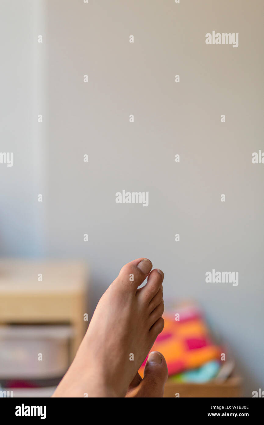 Caucasian male feet resting on a nap on an indoor home background Stock ...