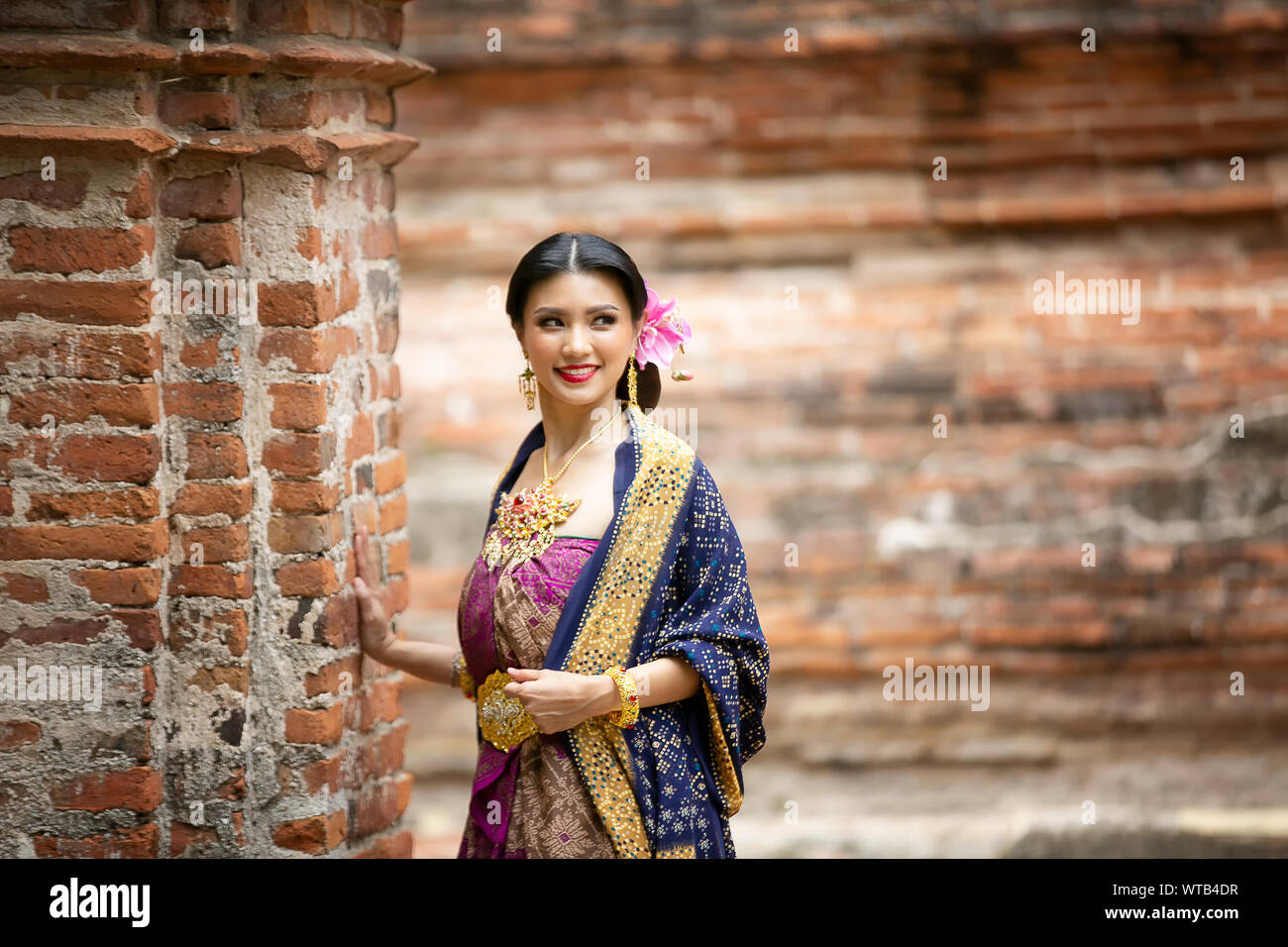 Woman In Traditional Clothing Standing Outdoors Stock Photo - Alamy