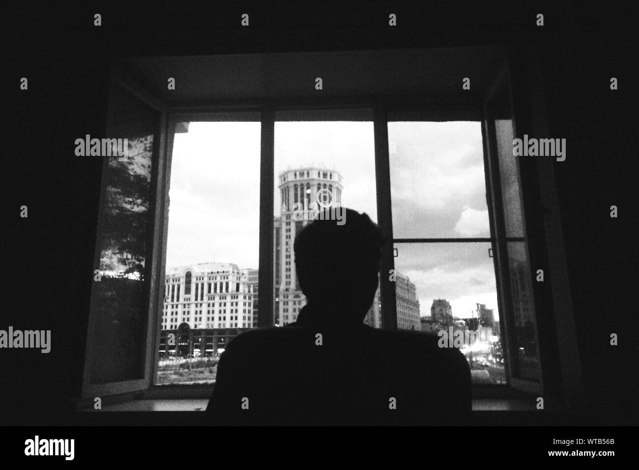 Buildings through window architecture Black and White Stock Photos ...