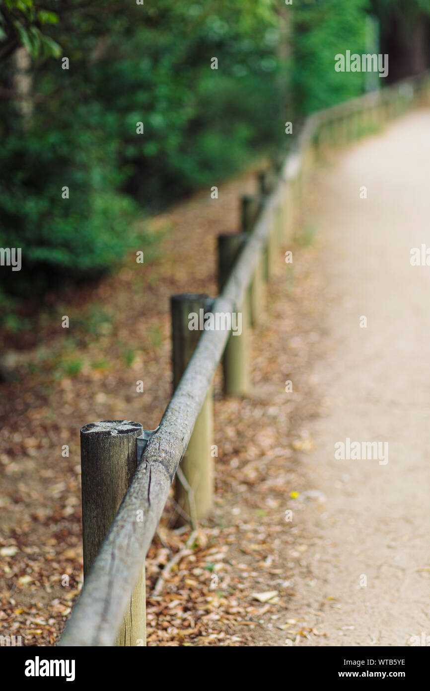 Wooden fence on an autumn landscape scene walkway path Stock Photo - Alamy
