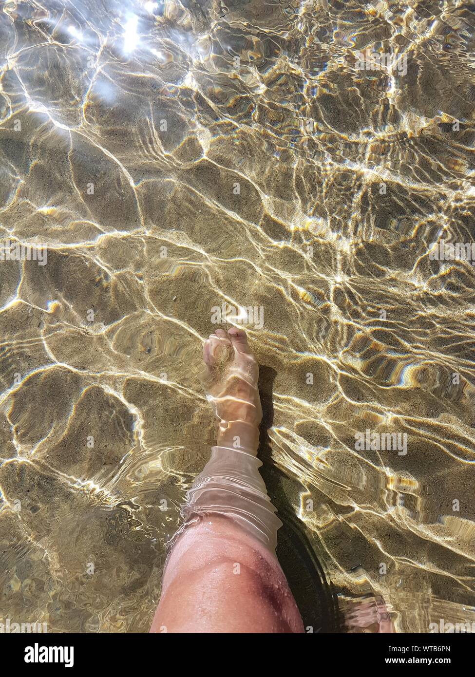 Feet in sea water hi-res stock photography and images - Alamy