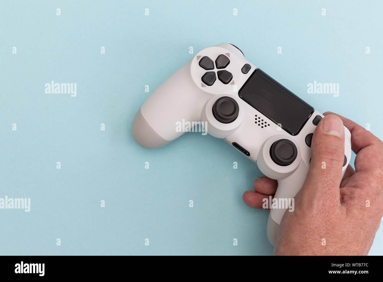 Video games man playing white gaming controller in hands isolated on ...
