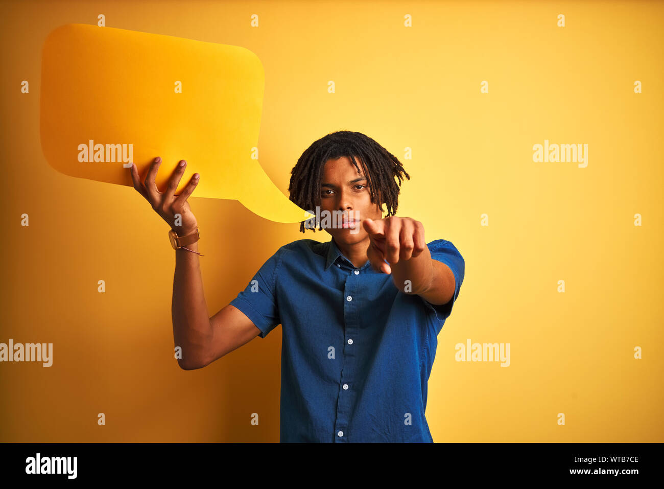 Afro american man with dreadlocks holding speech bubble over isolated ...