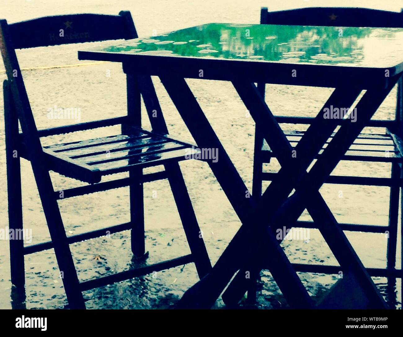 Wet chairs and table hi-res stock photography and images - Alamy