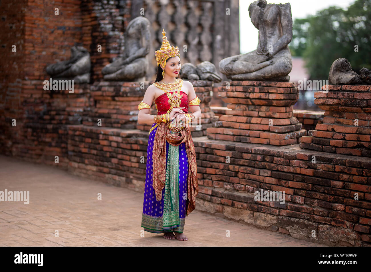 Portrait Of Woman In Traditional Clothing Standing Against Wall Stock ...