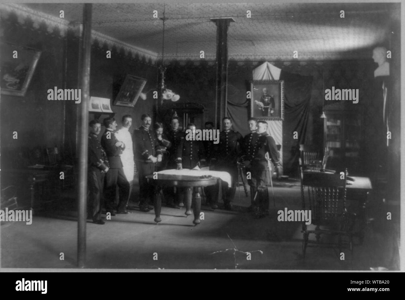 Mexican military officers standing around a table in a planning room ...