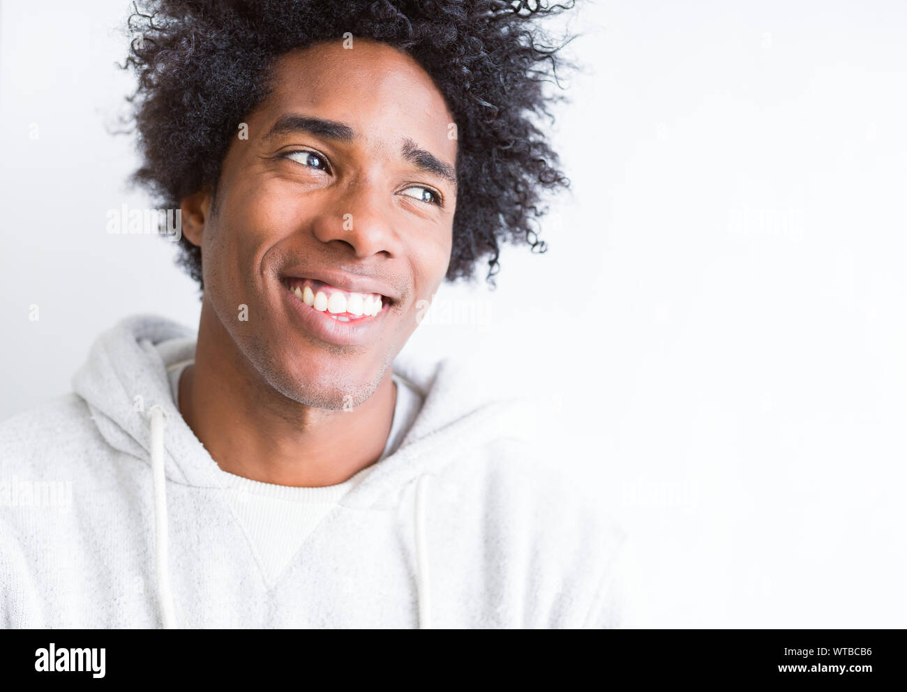 African American man over white isolated background smiling looking ...
