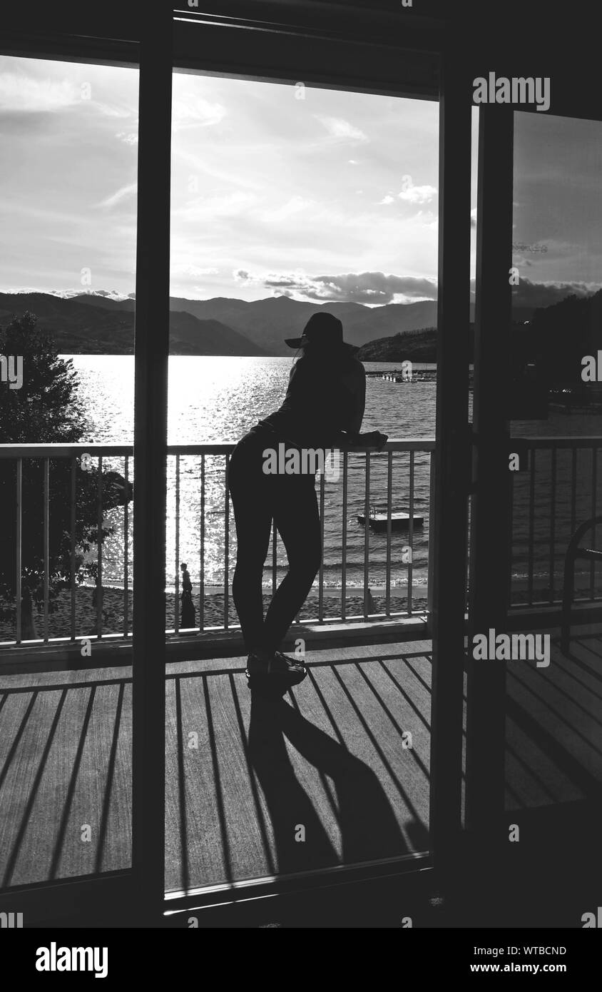 Woman on balcony Black and White Stock Photos & Images - Alamy