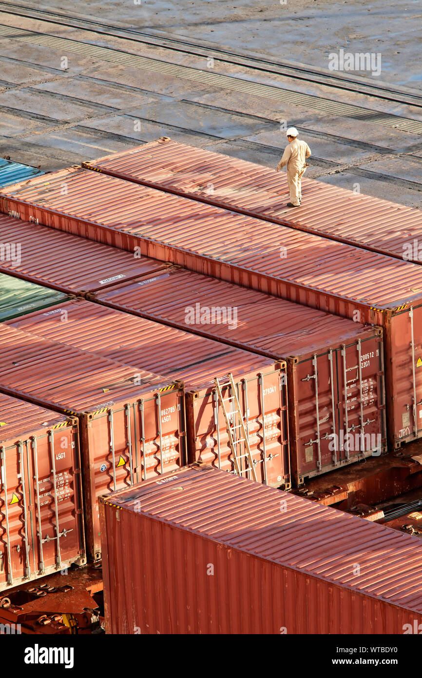 man walking on shipping containers, overhead view Stock Photo - Alamy