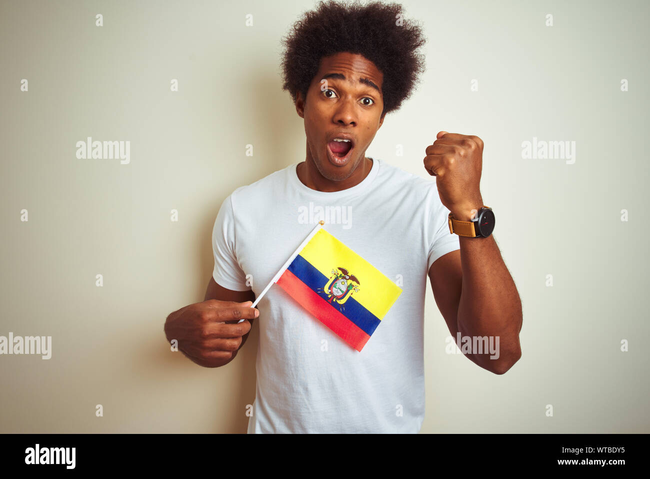 Afro american man holding Colombia Colombian flag standing over ...