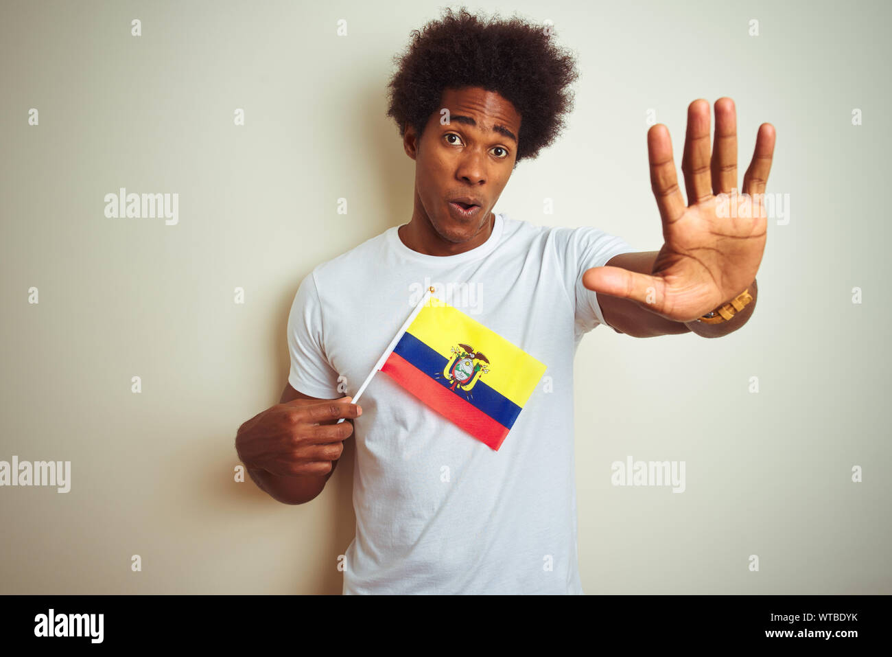 Afro american man holding Colombia Colombian flag standing over ...