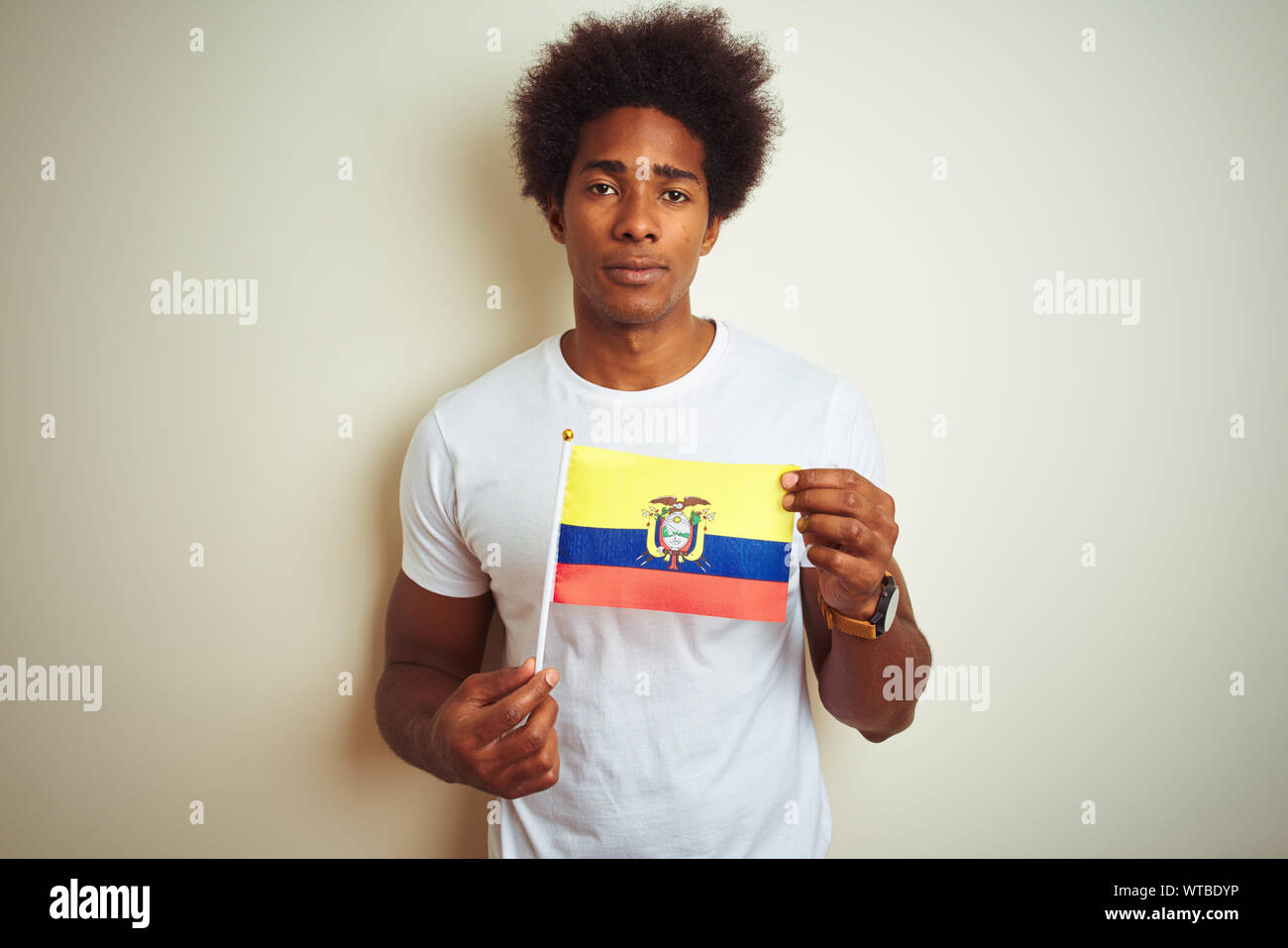 Afro american man holding Colombia Colombian flag standing over ...
