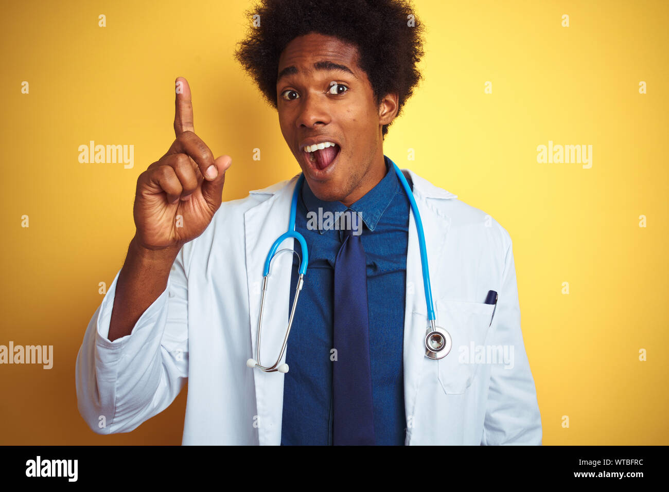 African american doctor man wearing stethoscope standing over isolated ...