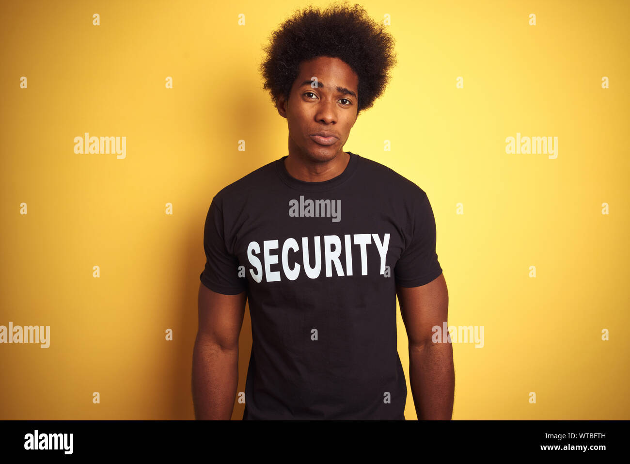 American safeguard man with afro hair wearing security uniform over ...