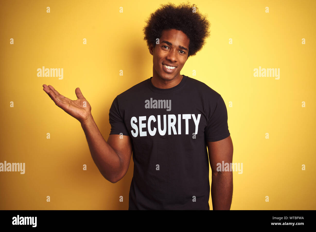 American safeguard man with afro hair wearing security uniform over ...