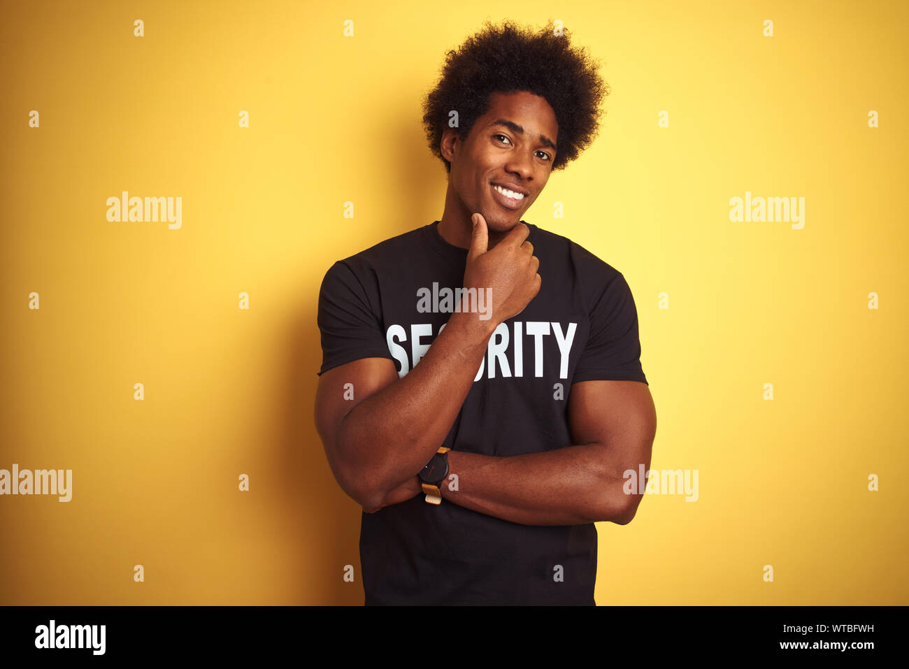 American safeguard man with afro hair wearing security uniform over ...