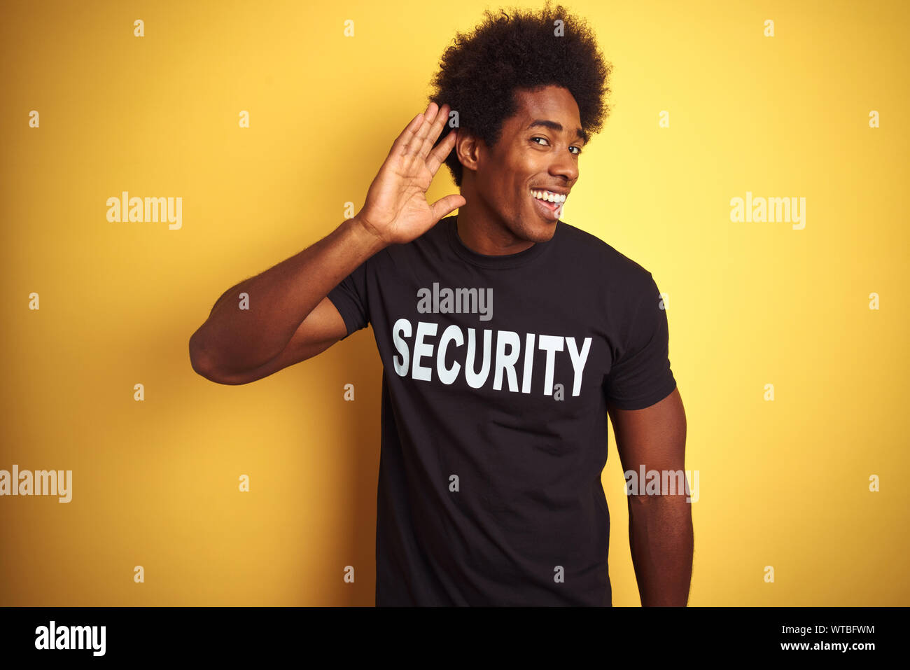 American safeguard man with afro hair wearing security uniform over ...