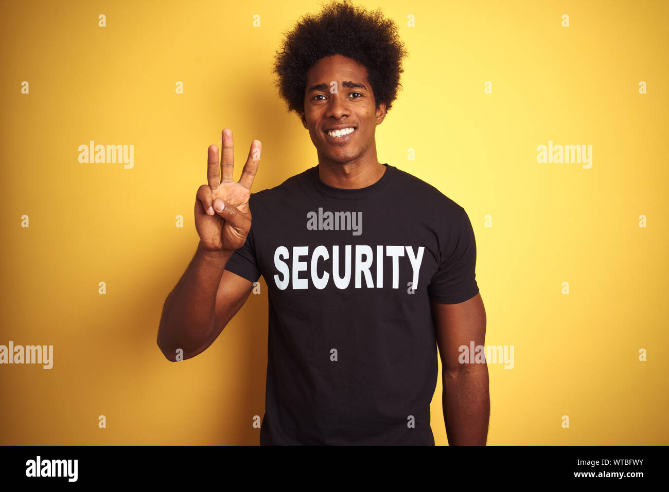 American safeguard man with afro hair wearing security uniform over ...