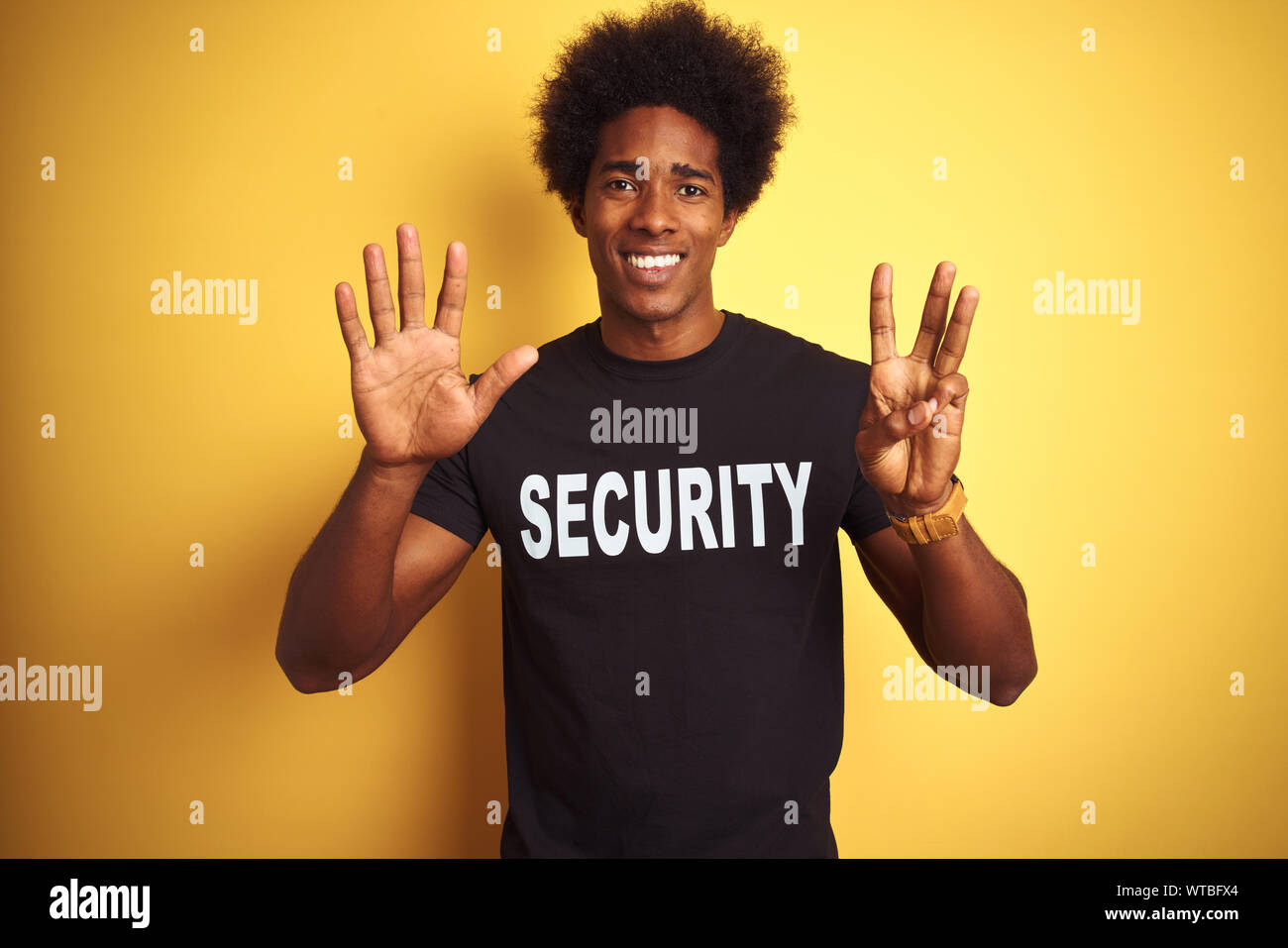 American safeguard man with afro hair wearing security uniform over ...