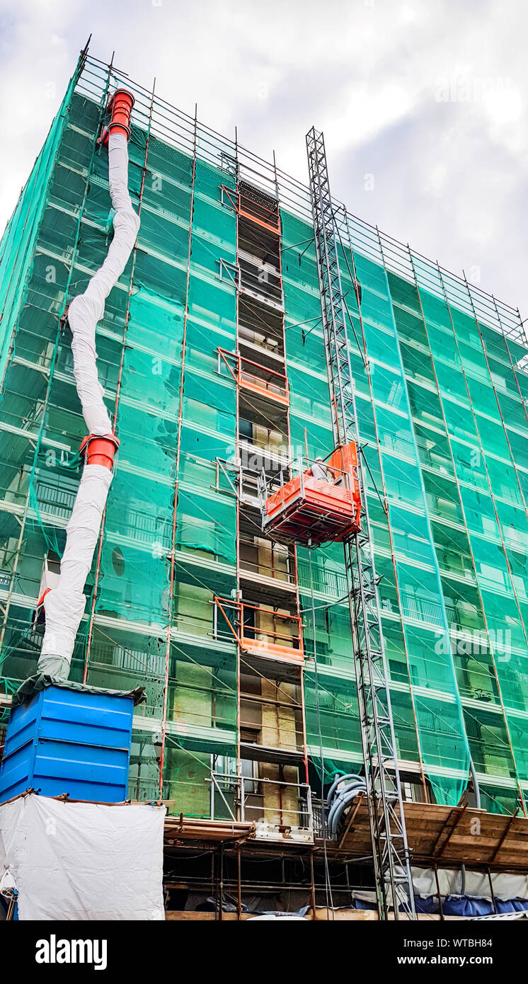 Renovations apartment building with scaffolding, Apartment building ...