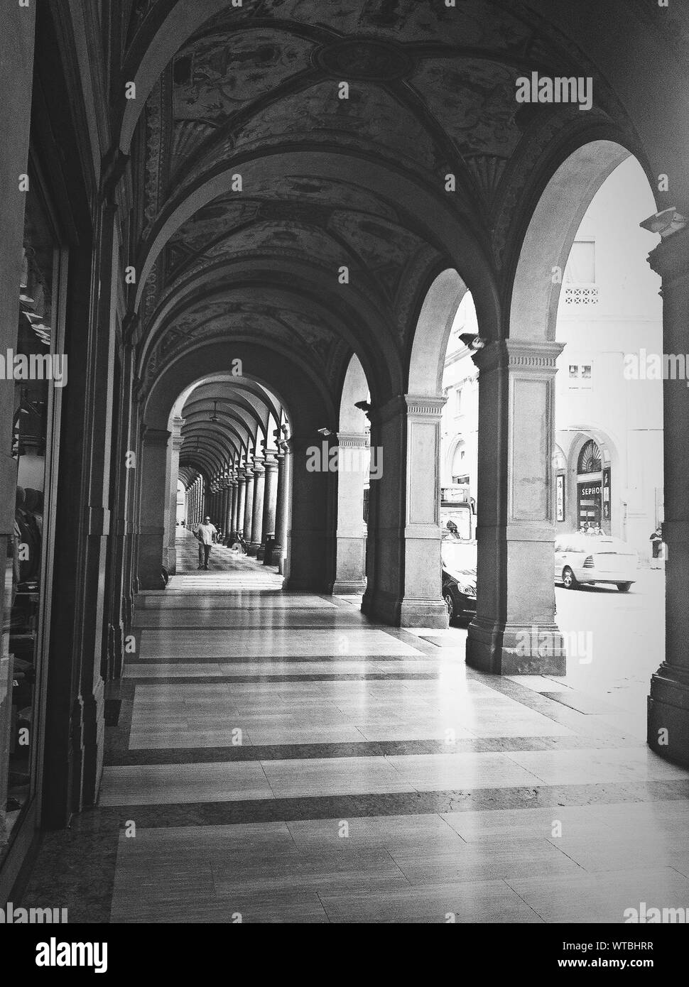Man Walking In Building Corridor Stock Photo - Alamy