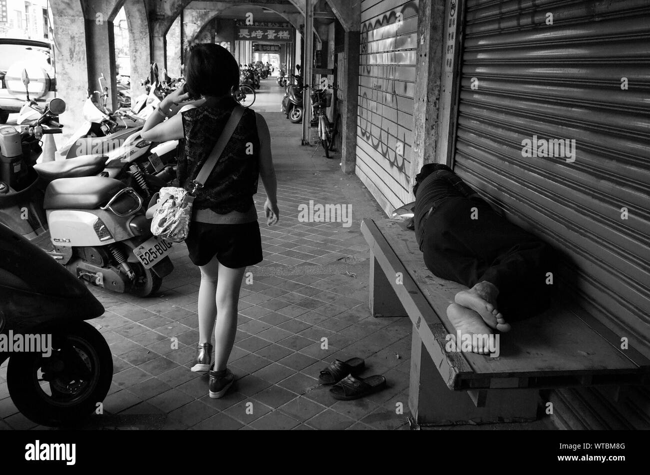 Homeless woman barefoot hi-res stock photography and images - Alamy