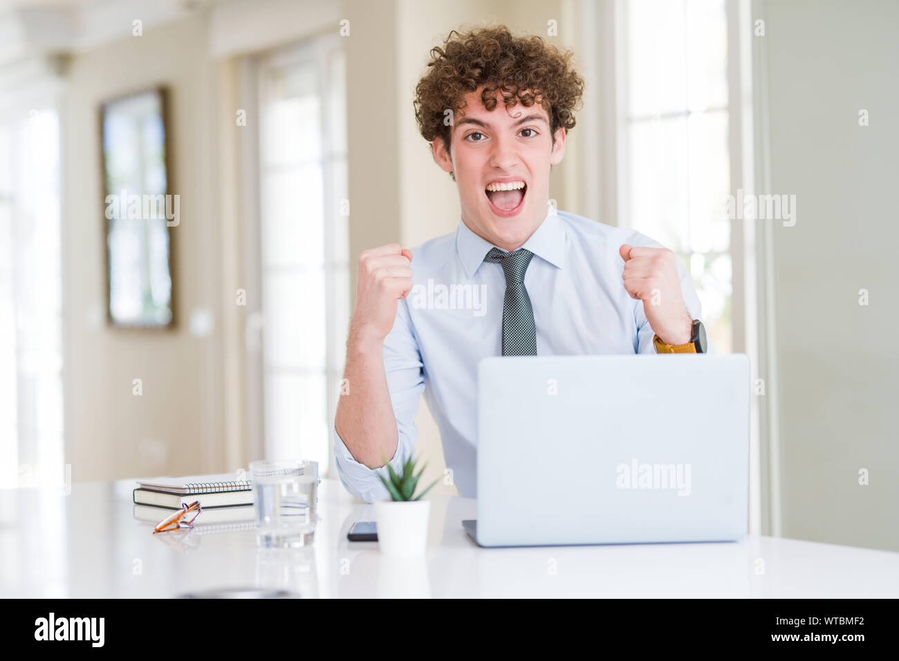 Young business man working with computer laptop at the office ...