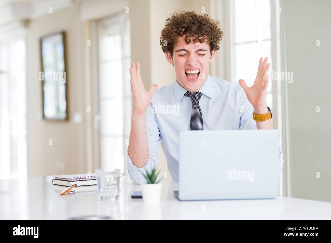 Young business man working with computer laptop at the office ...