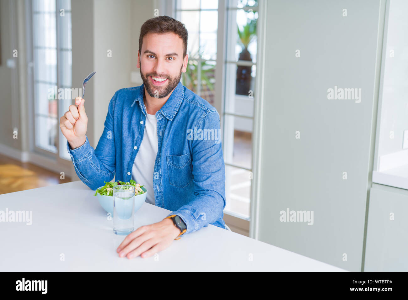 Young man eating peas hi-res stock photography and images - Alamy