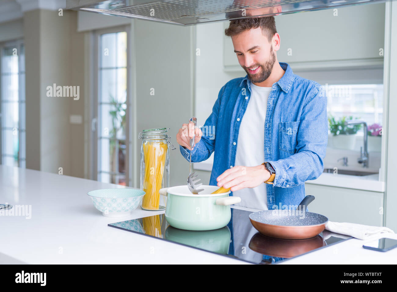 Hispanic boy eating pasta hi-res stock photography and images - Alamy