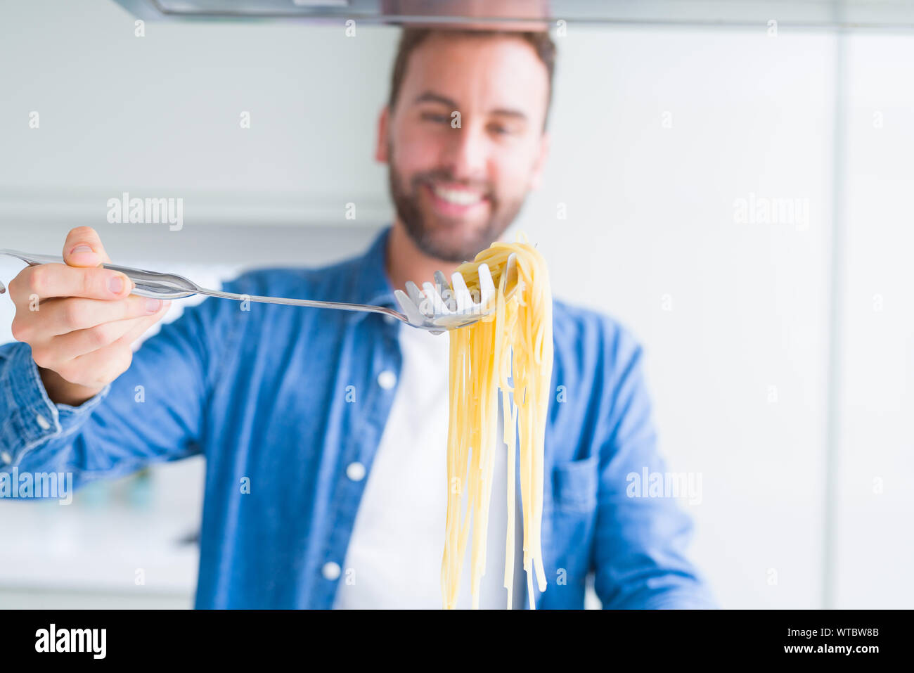 Hispanic boy eating pasta hi-res stock photography and images - Alamy