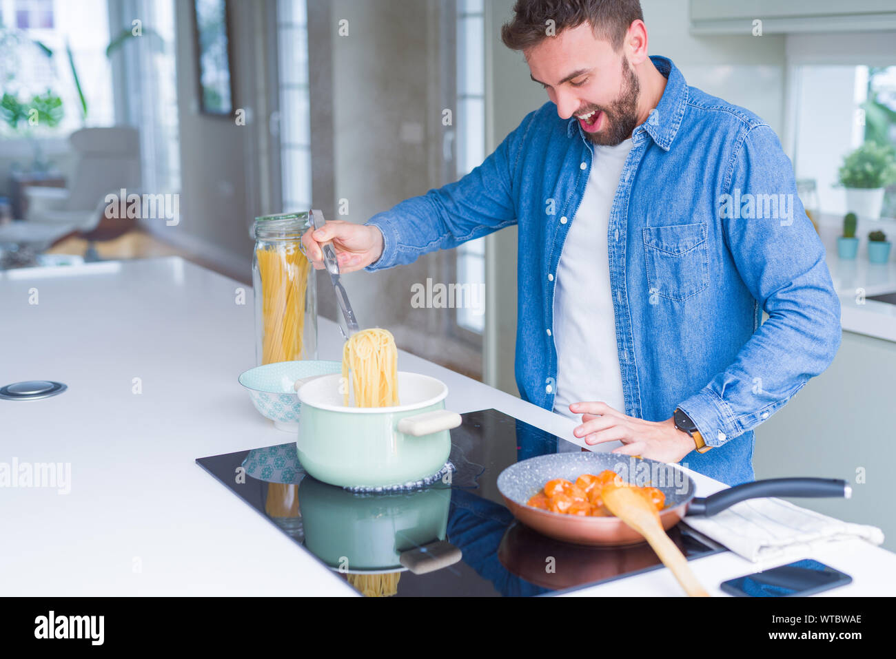 Hispanic boy eating pasta hi-res stock photography and images - Alamy