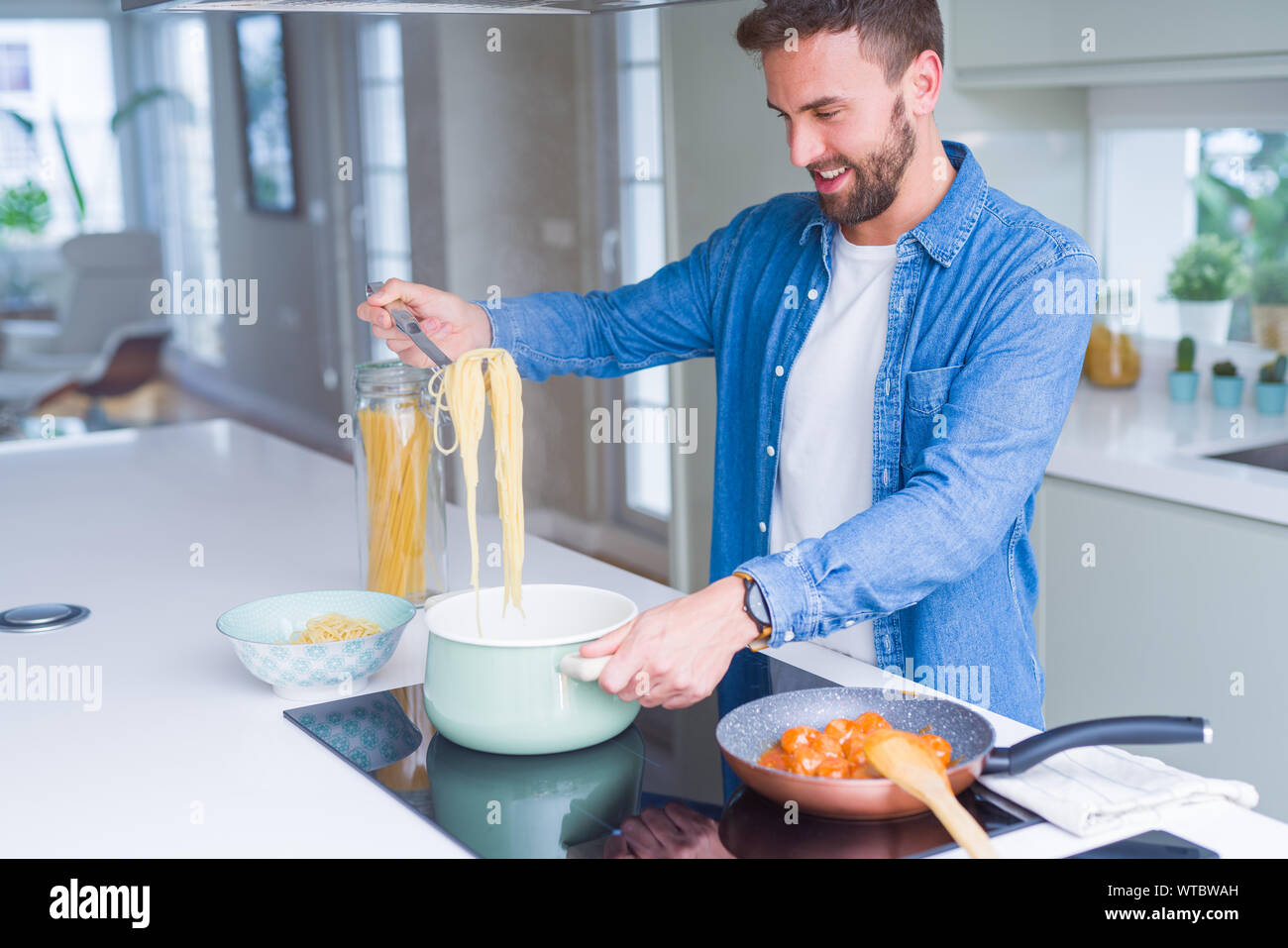 Hispanic boy eating pasta hi-res stock photography and images - Alamy