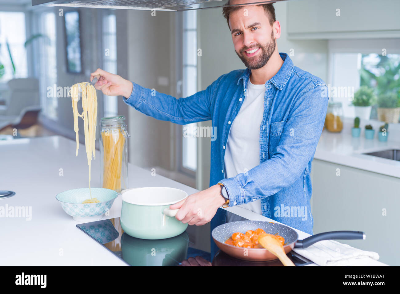 Hispanic boy eating pasta hi-res stock photography and images - Alamy