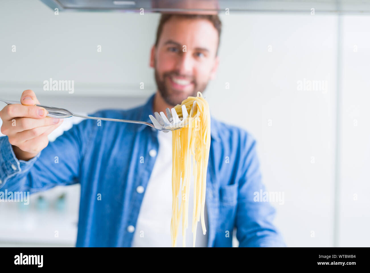 Hispanic boy eating pasta hi-res stock photography and images - Alamy
