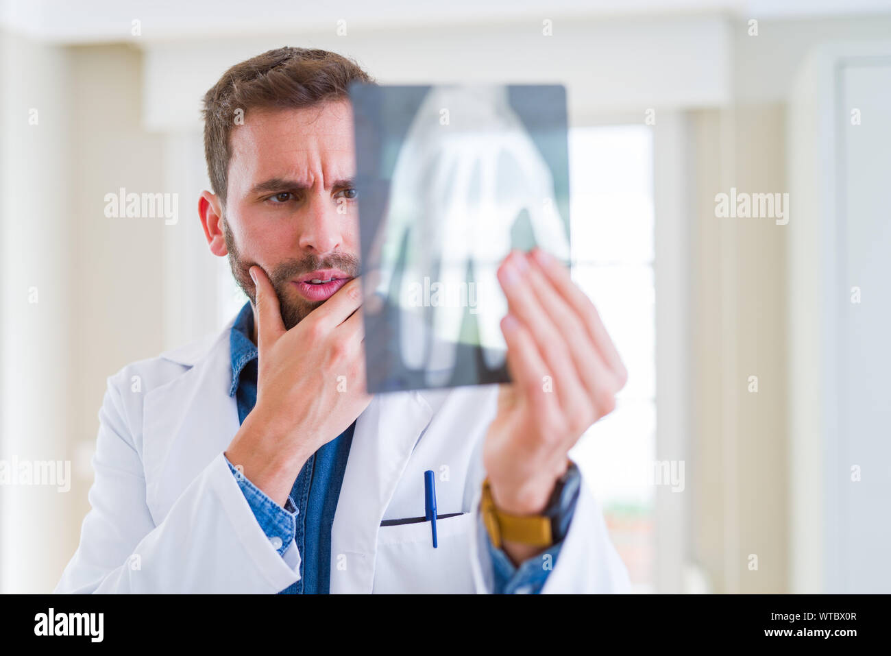 Doctor man looking at x-ray radiography doing body examination Stock ...