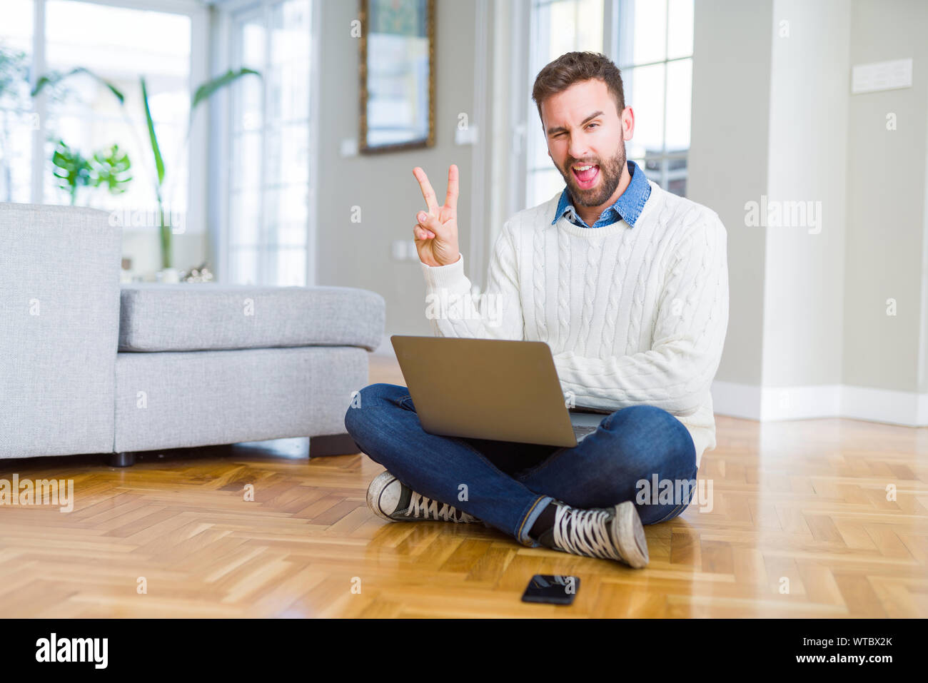 Handsome man wearing working using computer laptop smiling with happy ...