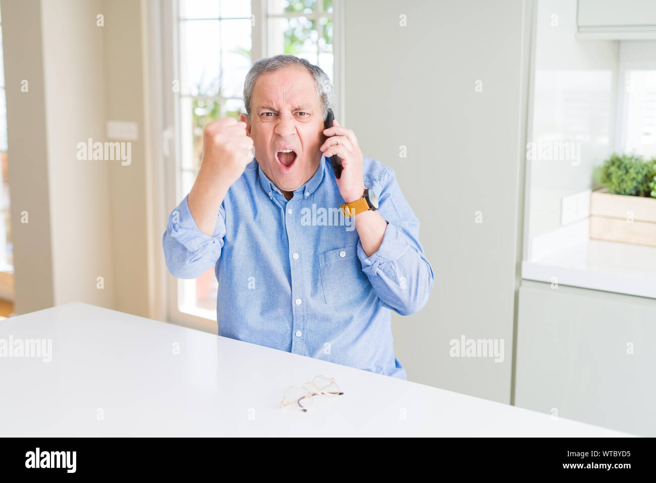 Middle age man annoyed phone hi-res stock photography and images - Alamy