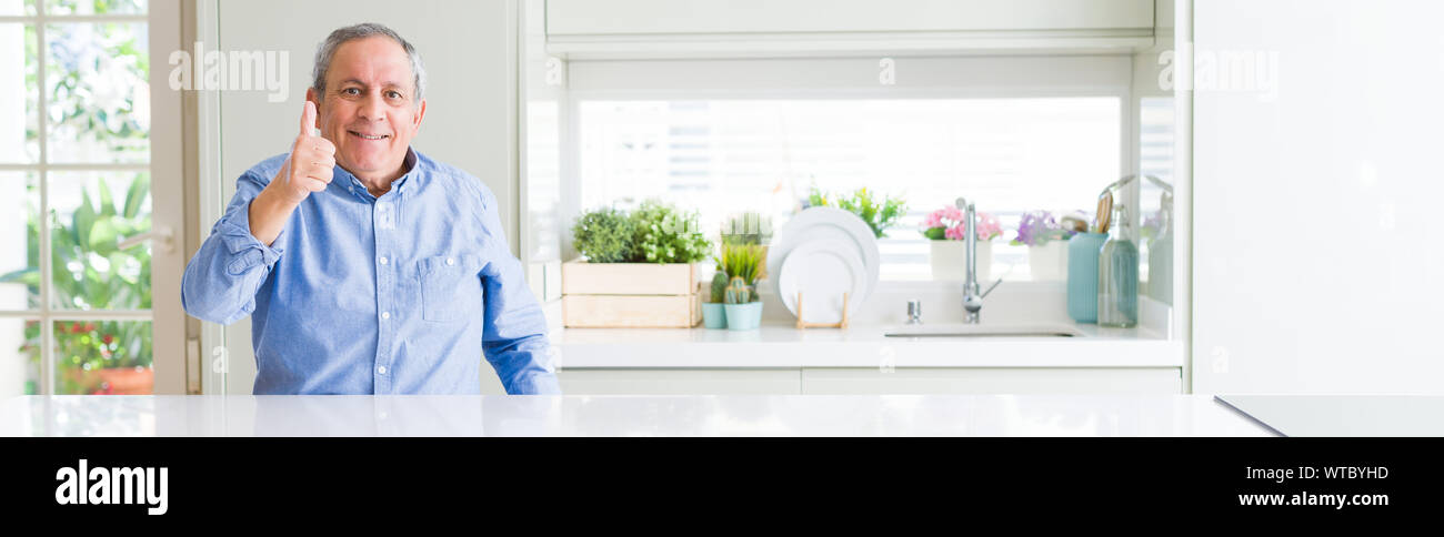 Wide angle perspective of handsome senior man at home doing happy ...