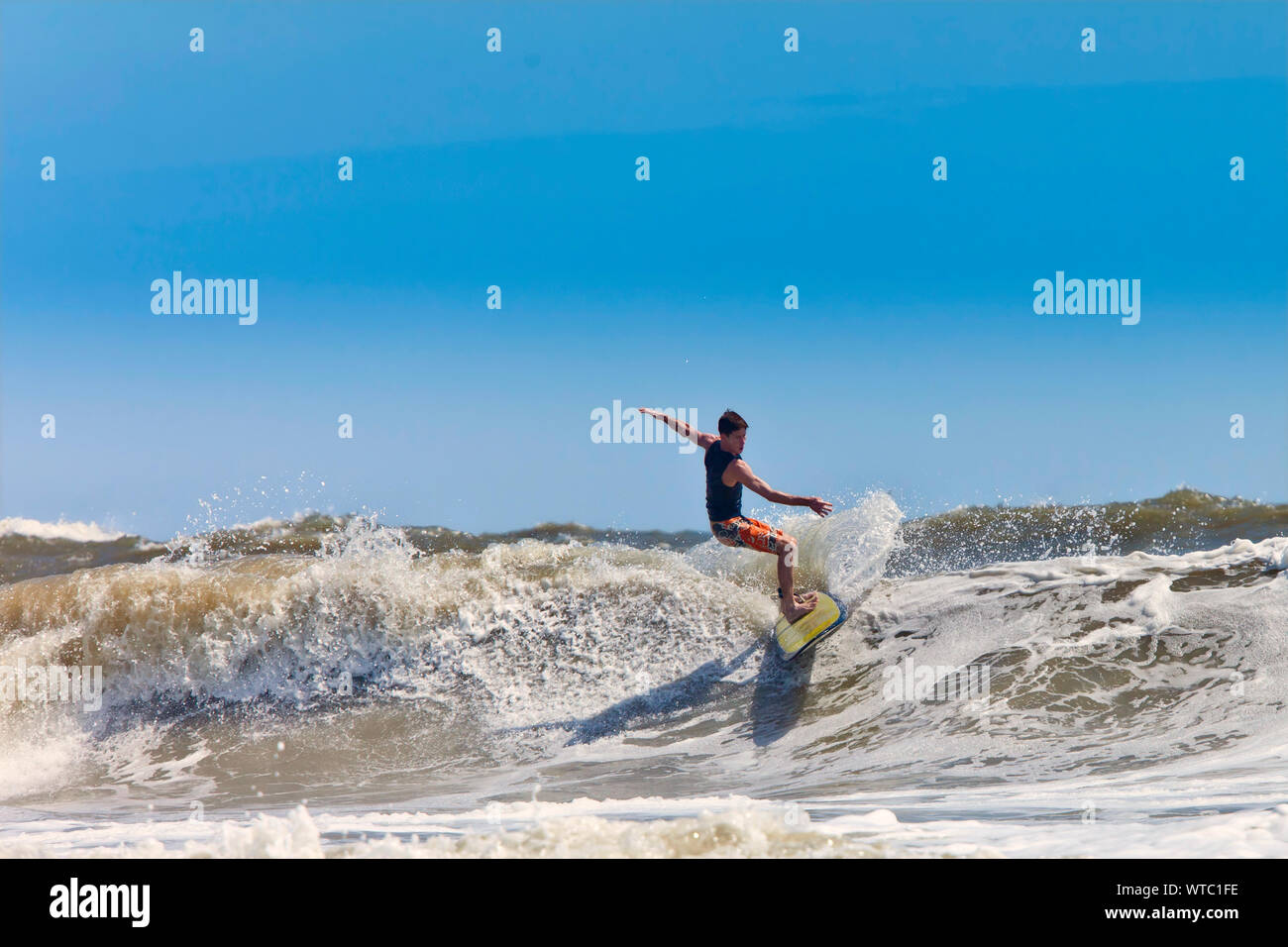 male surfer catching waves on the atlantic Stock Photo - Alamy