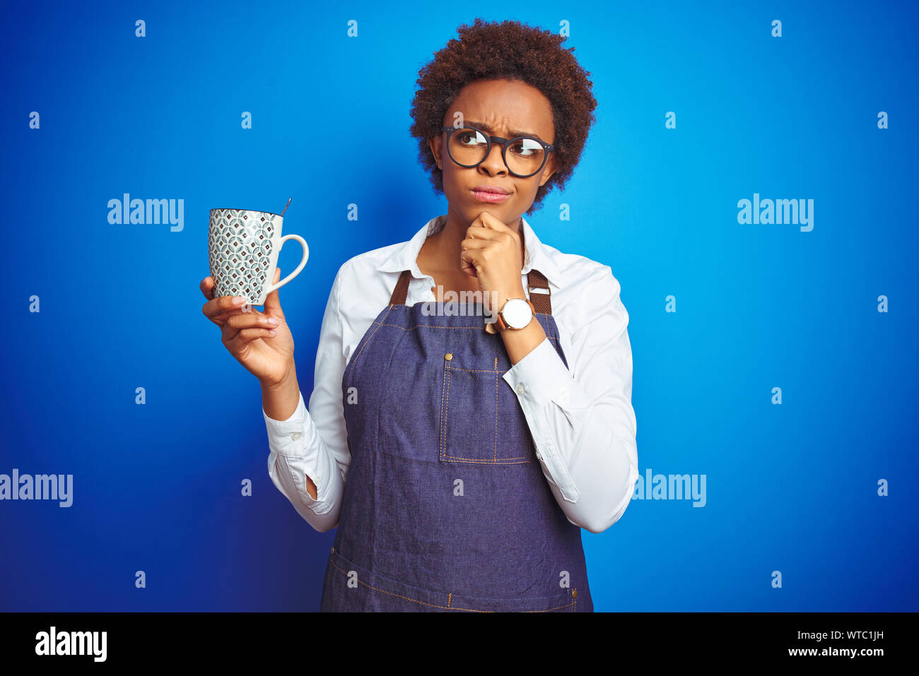 African american barista woman wearing bartender uniform holding cup ...
