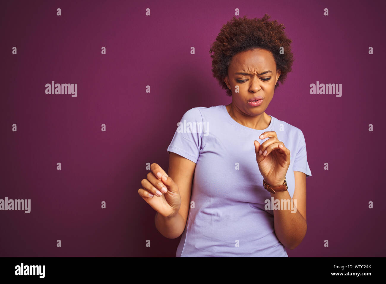 Young beautiful african american woman with afro hair over isolated ...