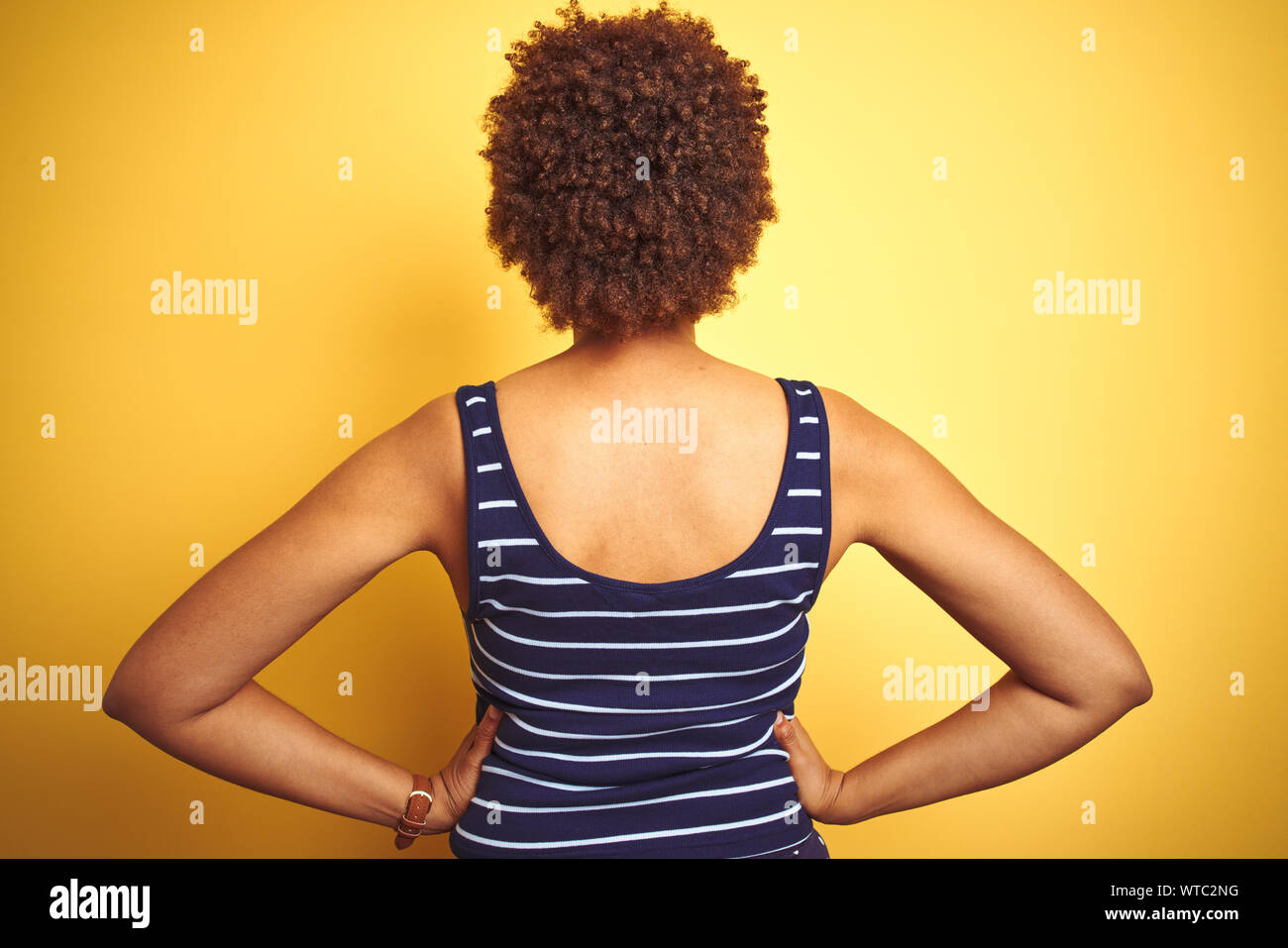 Beauitul african american woman wearing summer t-shirt over isolated ...