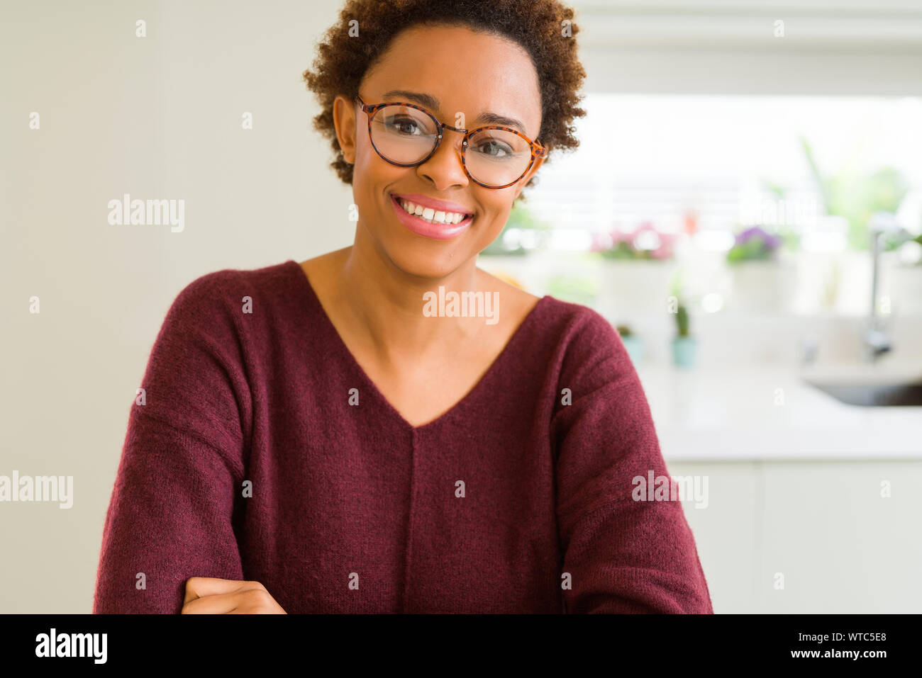 Beautiful young african woman with afro hair wearing glasses Stock ...